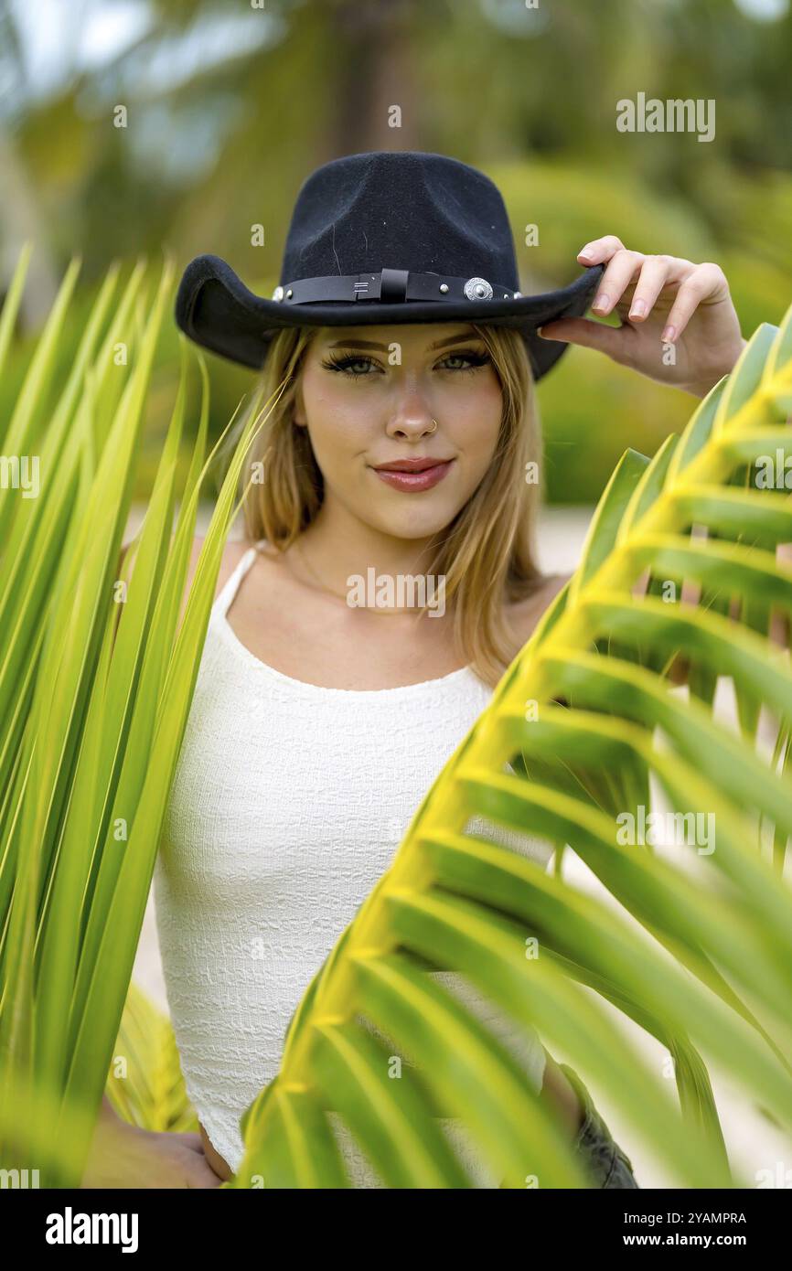 A radiant young woman embraces the Caribbean's charm, her laughter dancing in the warm breeze ...