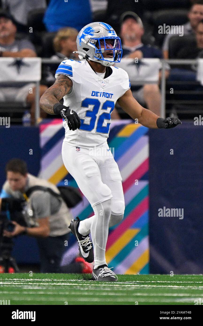 Detroit Lions safety Brian Branch (32) celebrates after he intercepts a ...