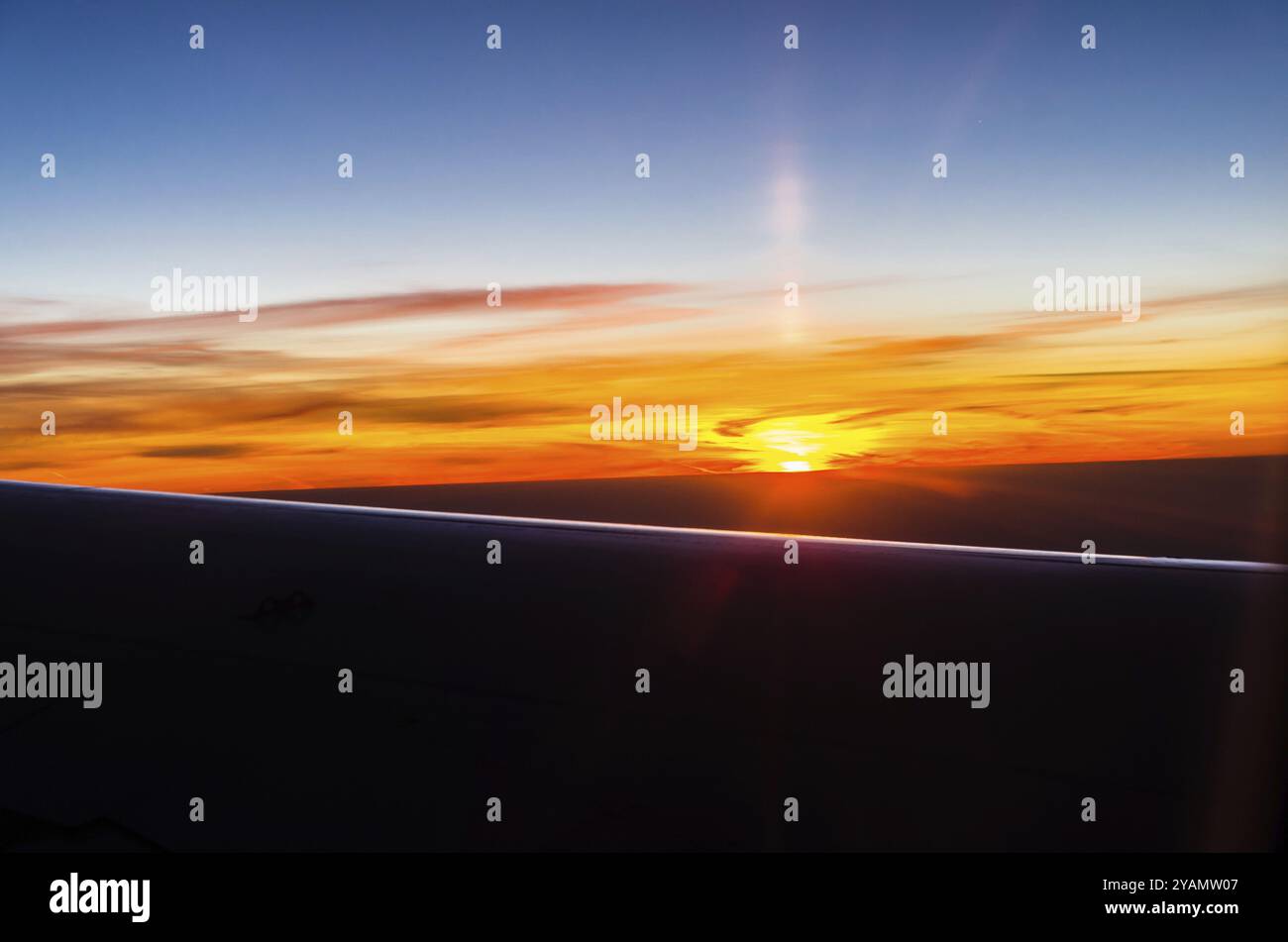 Sunset view in flight from airplane window Stock Photo - Alamy