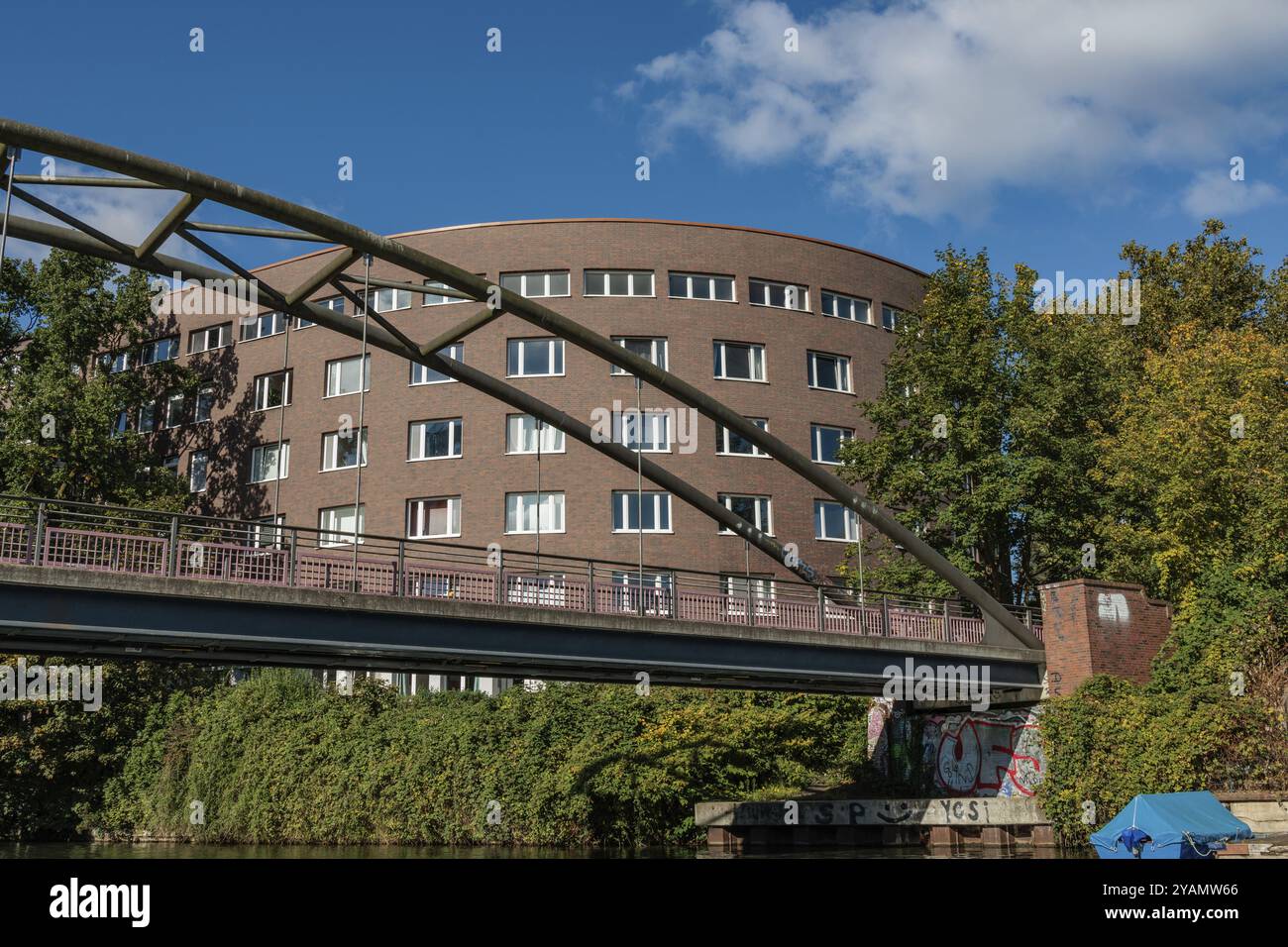 Curved bridge in front of a rounded brick building, Alster, Hamburg ...