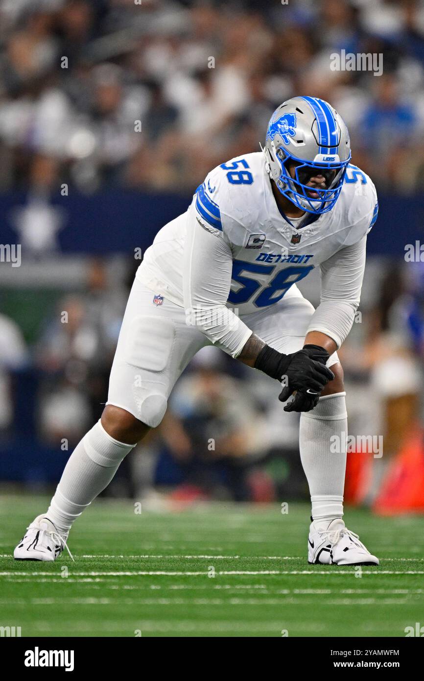 Detroit Lions offensive tackle Penei Sewell (58) gets set on the line ...