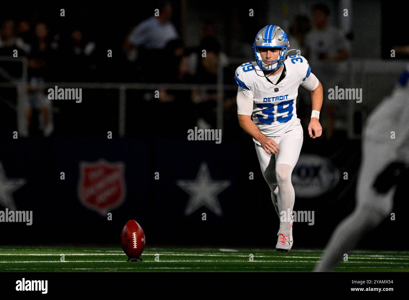 Detroit Lions place kicker Jake Bates (39) prepares to kick the ball ...