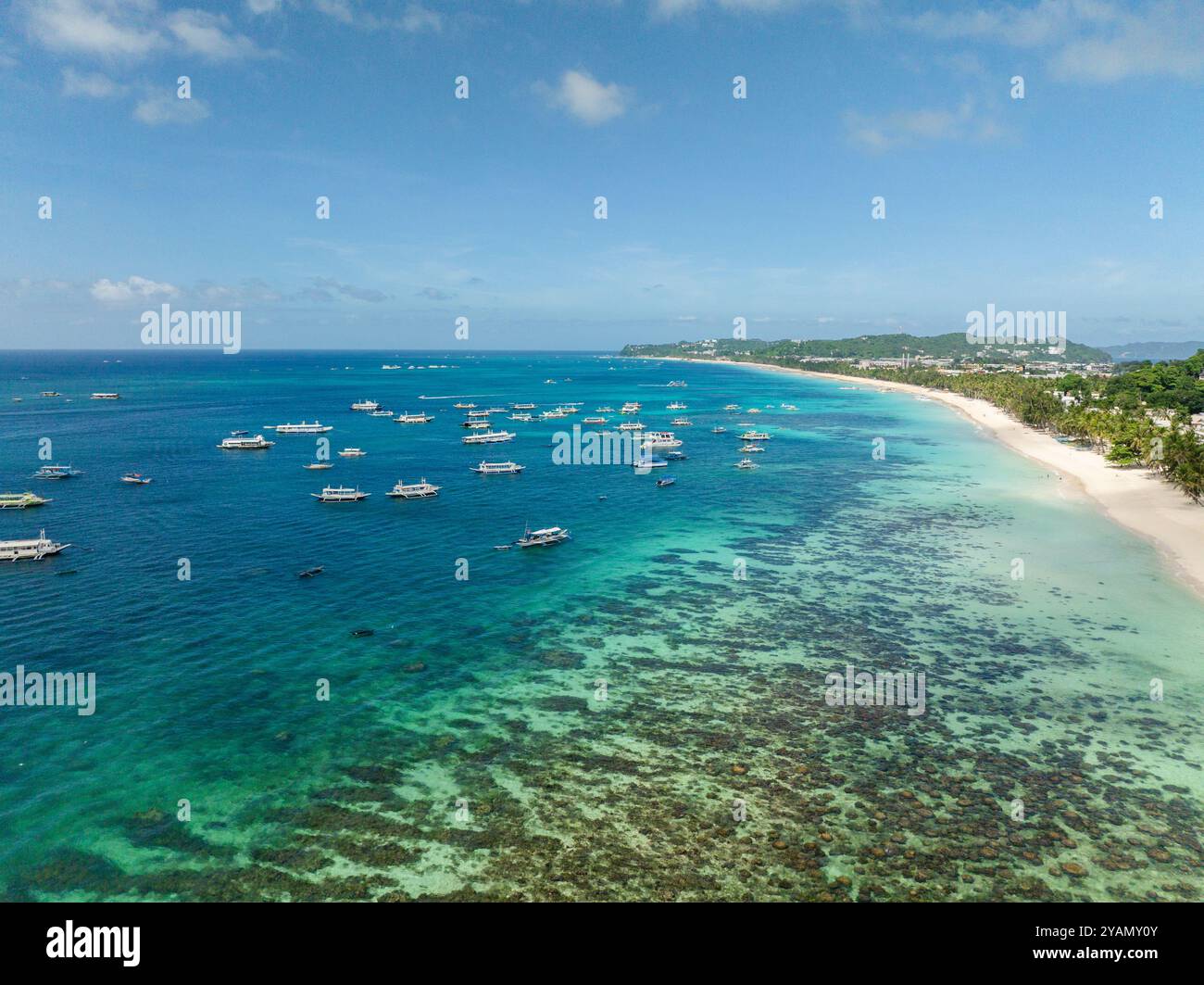 Tourist boats floating over turquoise sea water. Boracay. Island in ...