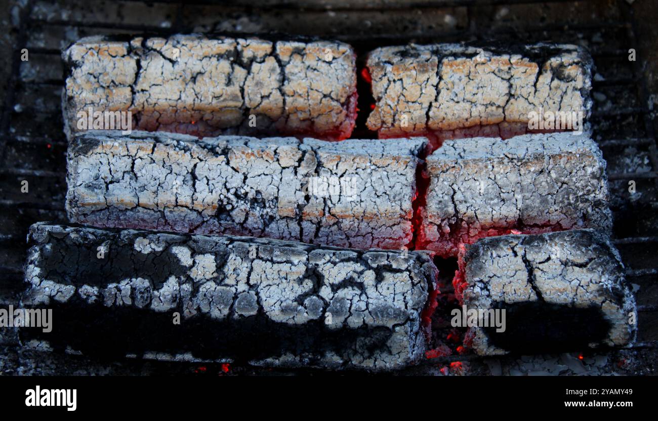 glowing embers from wooden briquettes. background. texture Stock Photo ...