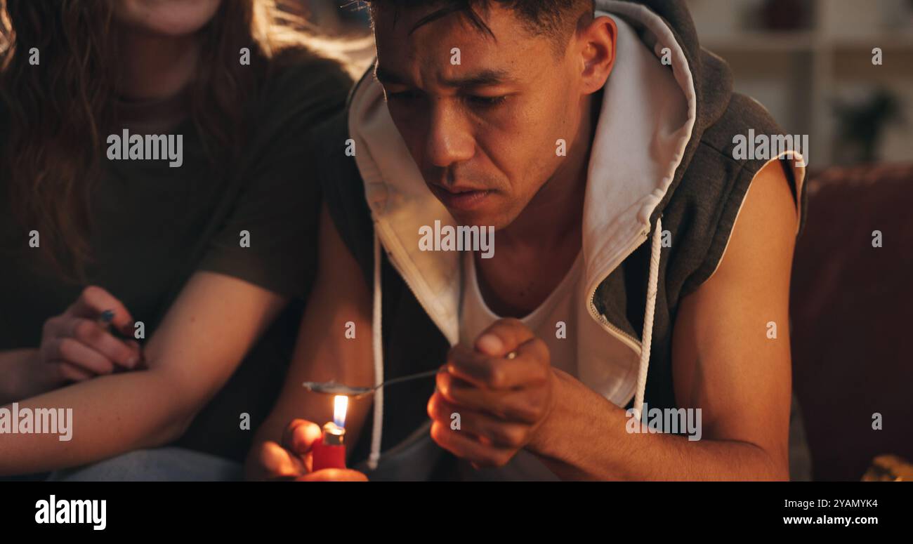 Spoon, flame and people with drugs in home for illegal, narcotics and ...