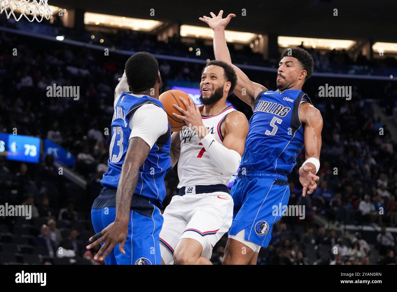 Los Angeles Clippers' Amir Coffey (7) is defended by Dallas Mavericks ...