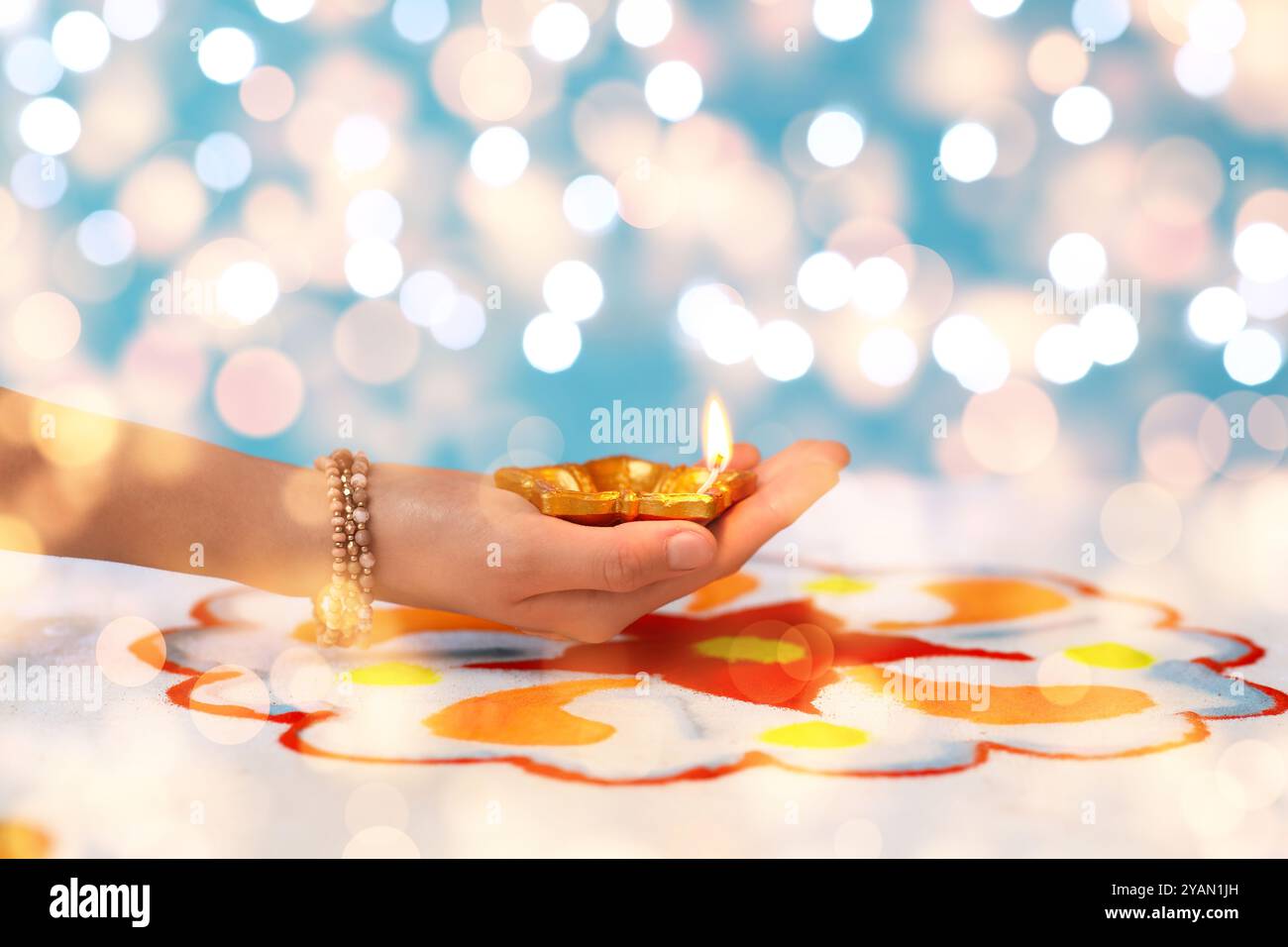 Hand of Indian woman holding diya lamp for Diwali (Festival of lights ...