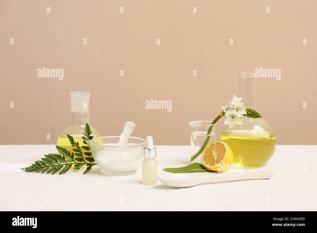 Laboratory glassware with ingredients and samples for preparing natural ...