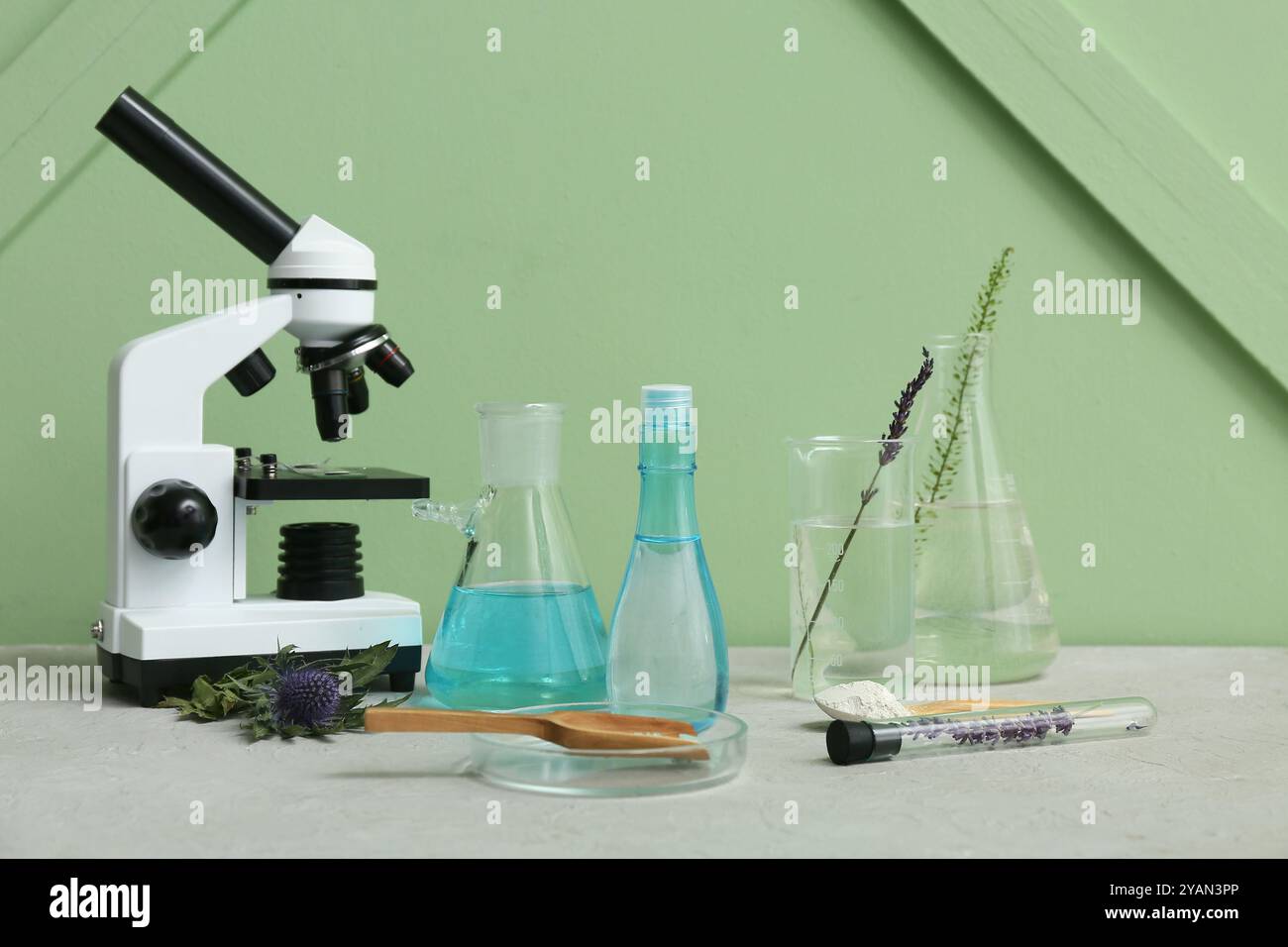 Laboratory glassware and microscope with ingredients for preparing ...