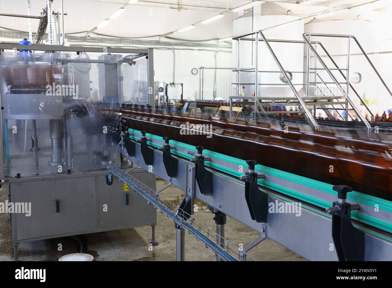 Bottles moving on factory conveyor hi-res stock photography and images ...