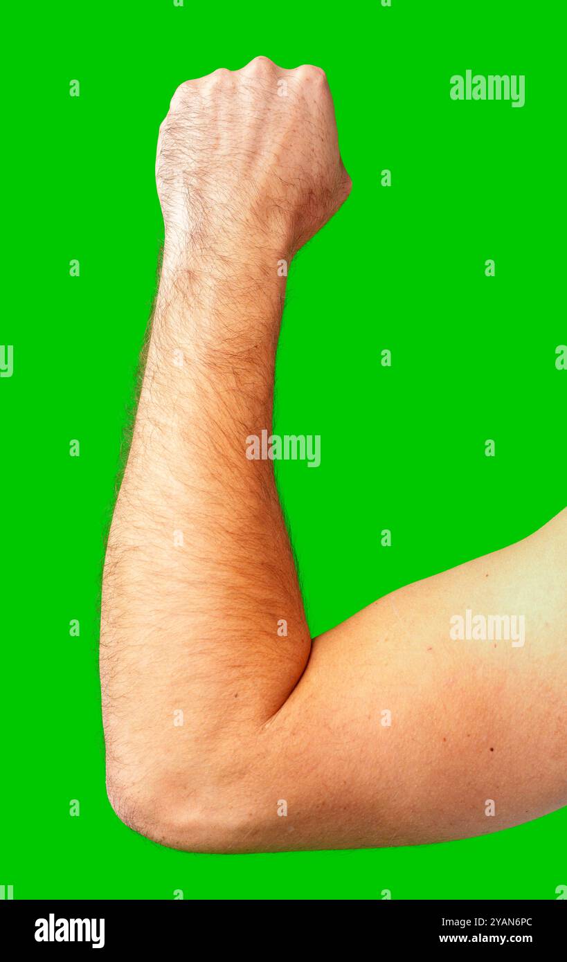 human arm gesturing with raised fingers against a bright green backdrop ...