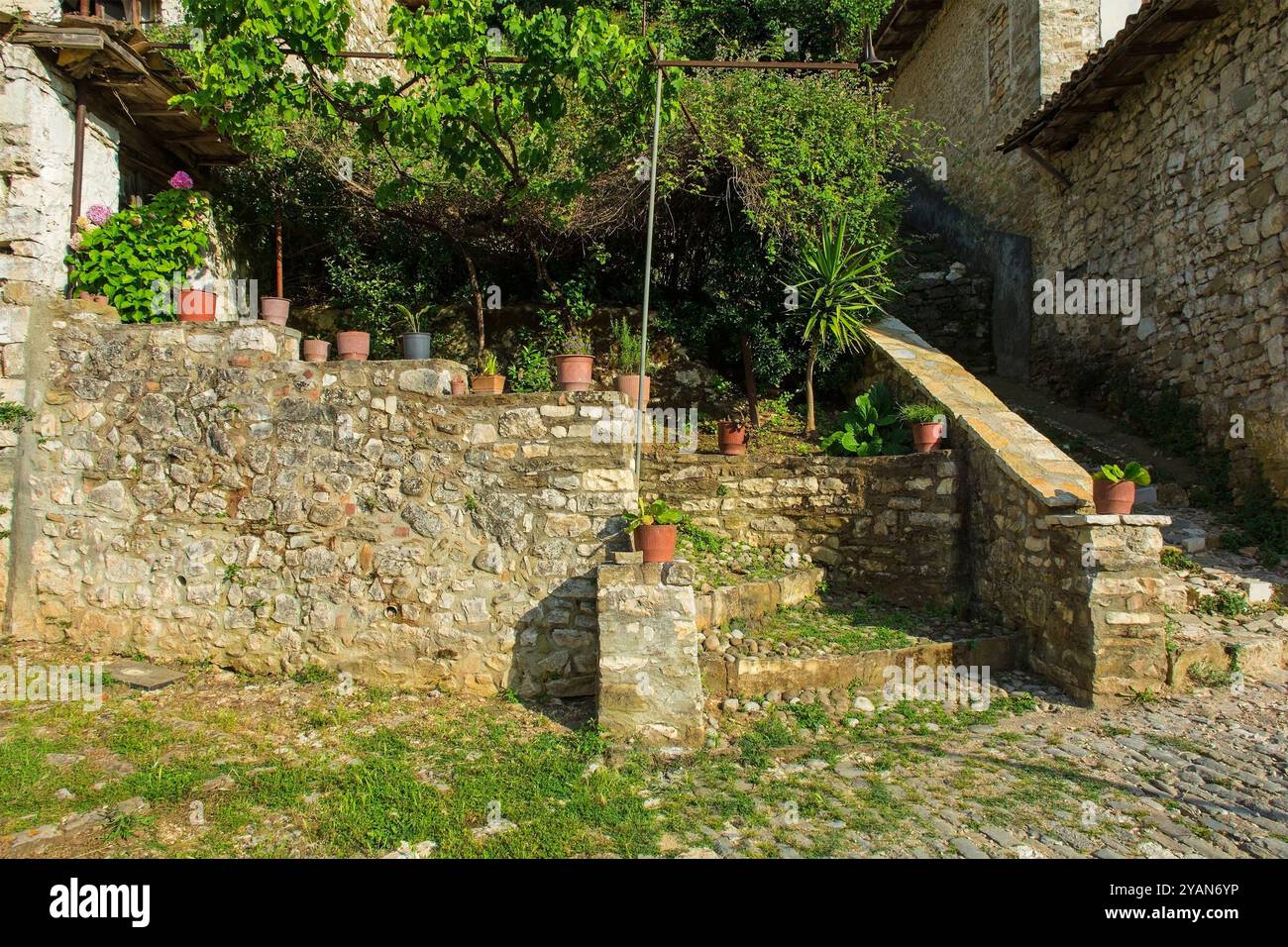 A small stepped garden outside an historic stone house in the Gorica ...