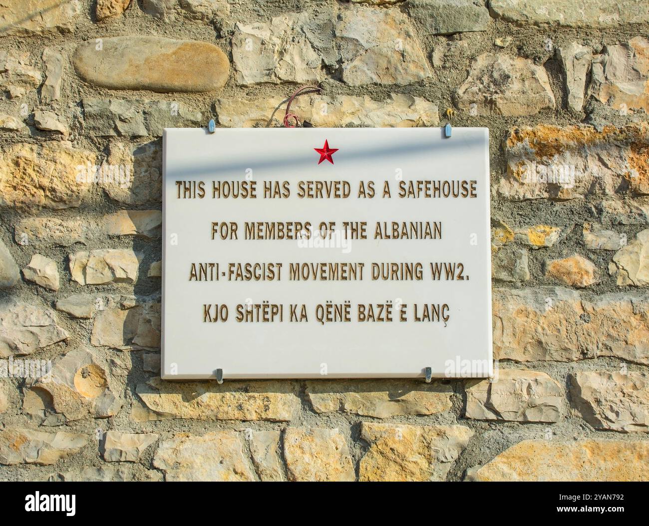Berat, Albania-June 1st 2024. A plaque in English and Italian on an ...
