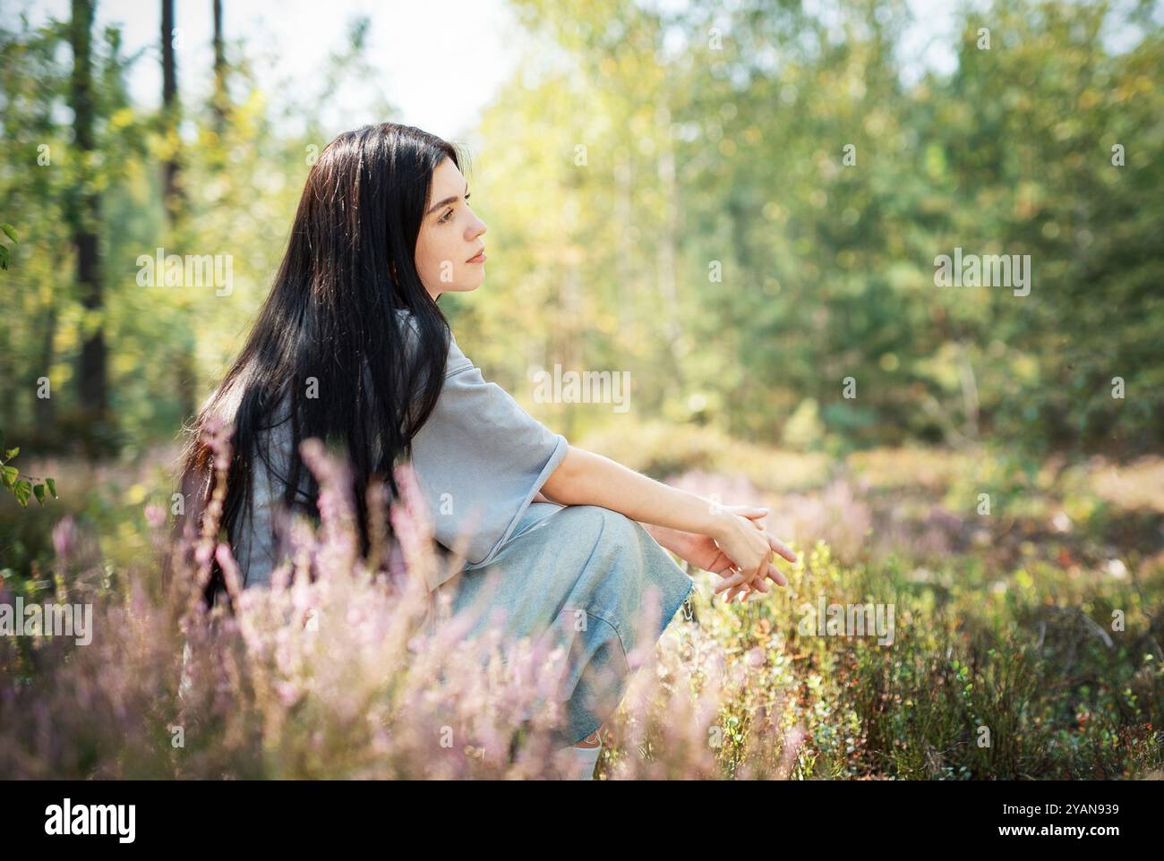 Woman in solitude sits down hi-res stock photography and images - Alamy