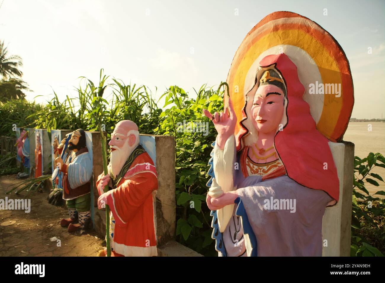 Sculptures of Taoist deities on the beach of Pulo Kemaro temple complex ...