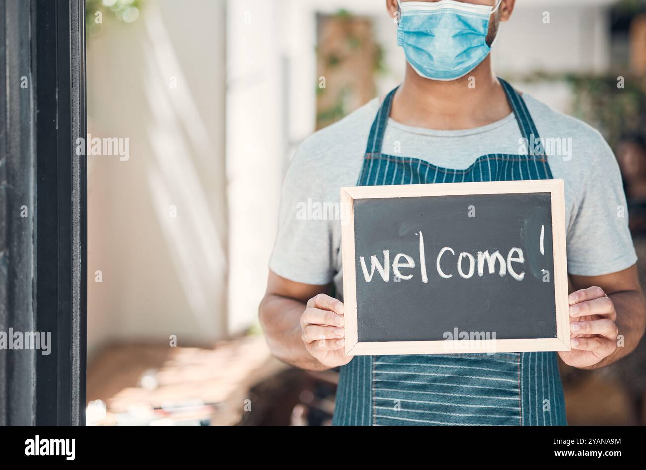 Hands, waiter and coffee shop with welcome sign or poster in small ...