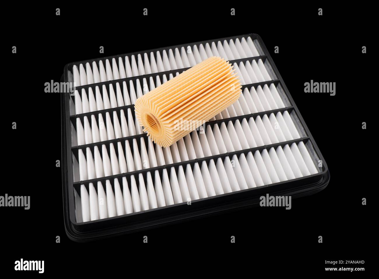 Oil filter, air filter isolated on black background. Spare parts of a ...