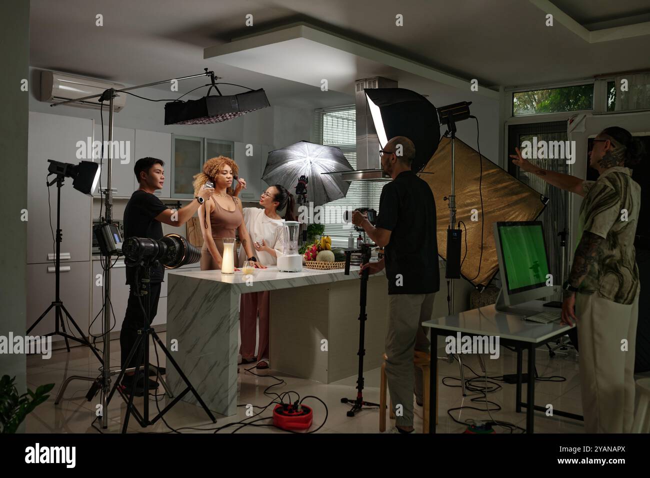 Cameraman Shooting Model In Studio Stock Photo - Alamy