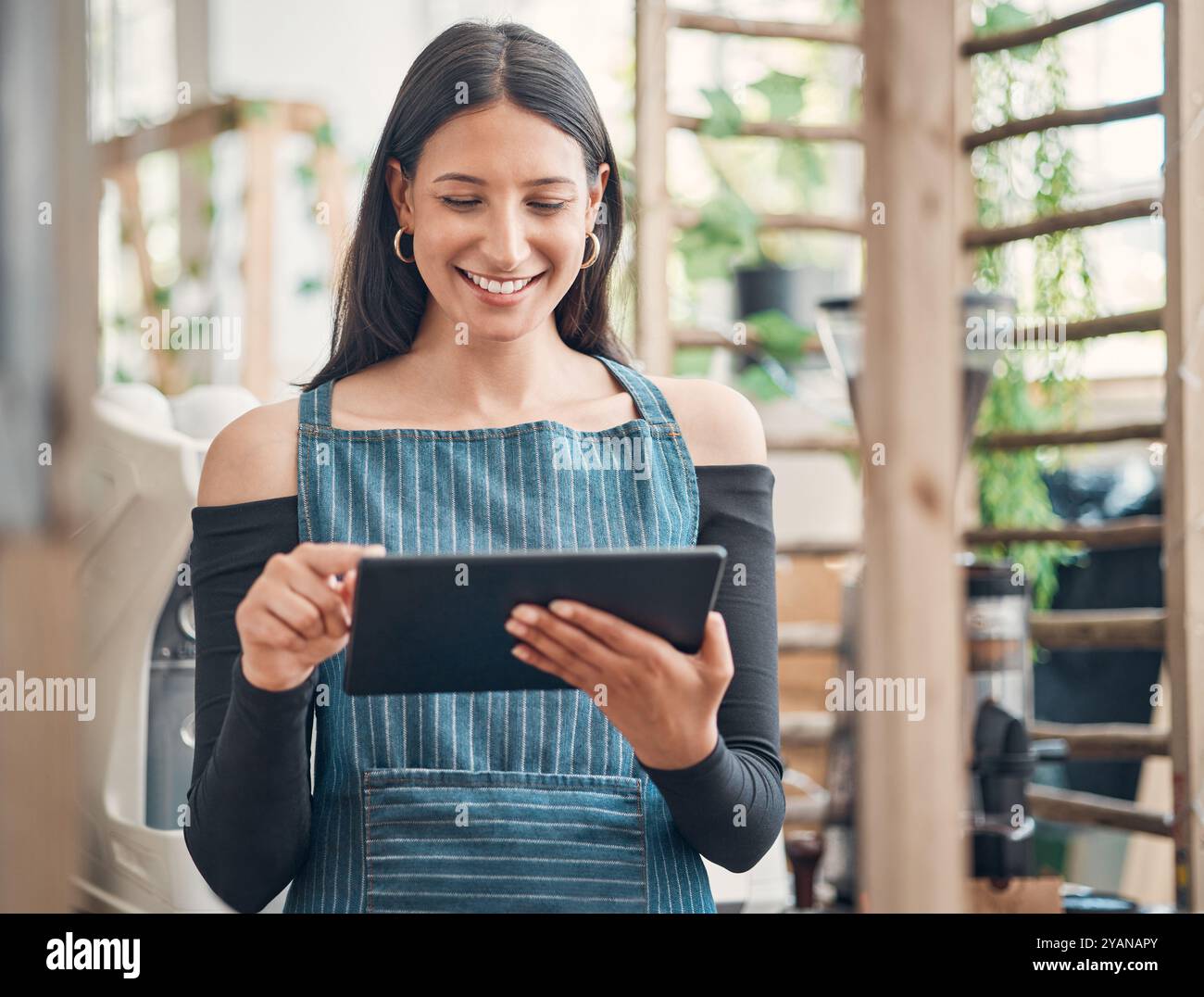 Small business, woman and smile in cafe with tablet, menu planning and ...