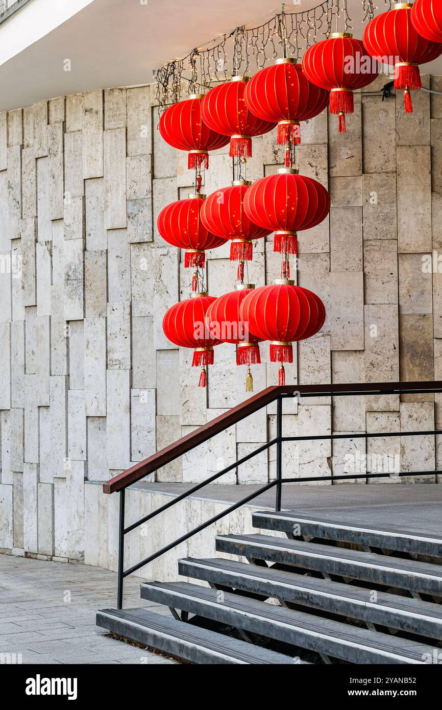 the entrance to the building is decorated with Chinese hanging lanterns ...