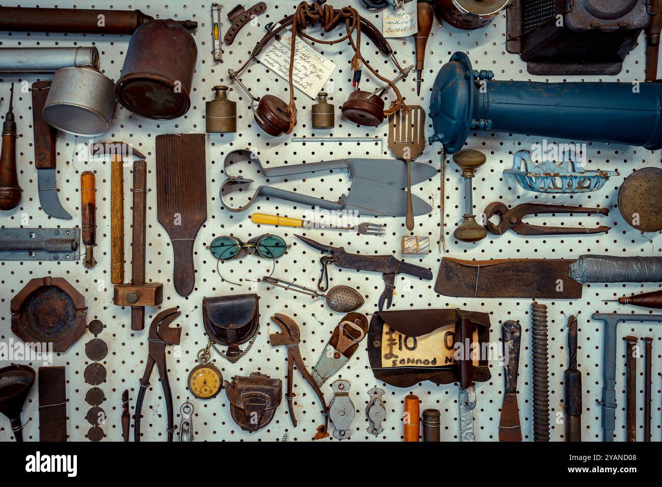 A collection of old hand tools arranged on the wall Stock Photo - Alamy