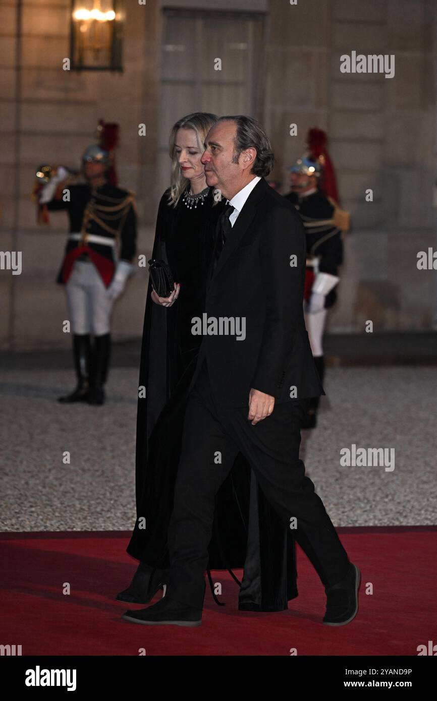 Xavier Niel and his partner Delphine Arnault arrive at the presidential ...