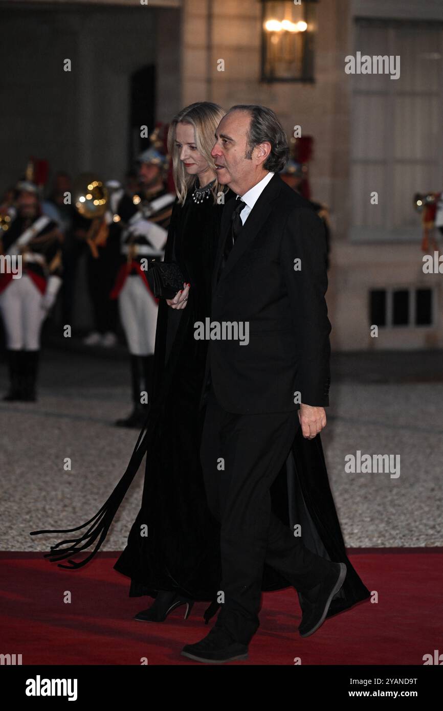 Xavier Niel and his partner Delphine Arnault arrive at the presidential ...