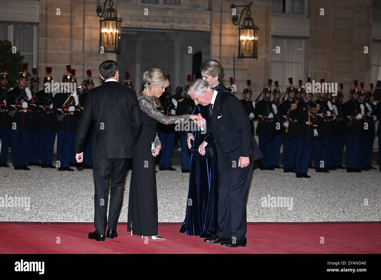 France's President Emmanuel Macron and his wife Brigitte Macron welcome ...