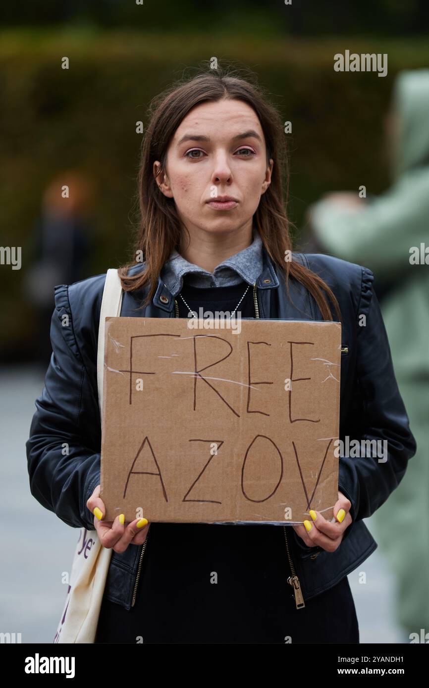 Ukrainian girl posing with a banner "Free Azov" at peaceful ...