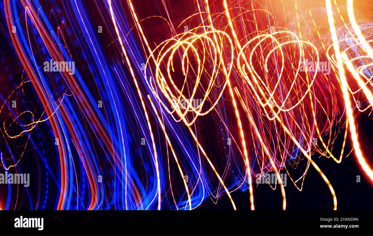 Long exposure light streaks of city lamps and vehicle traffic lights as ...