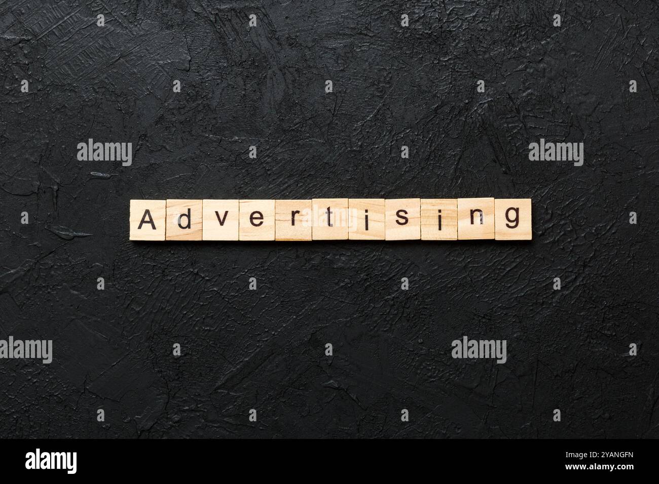 ADVERTISING word written on wood block. ADVERTISING text on cement ...