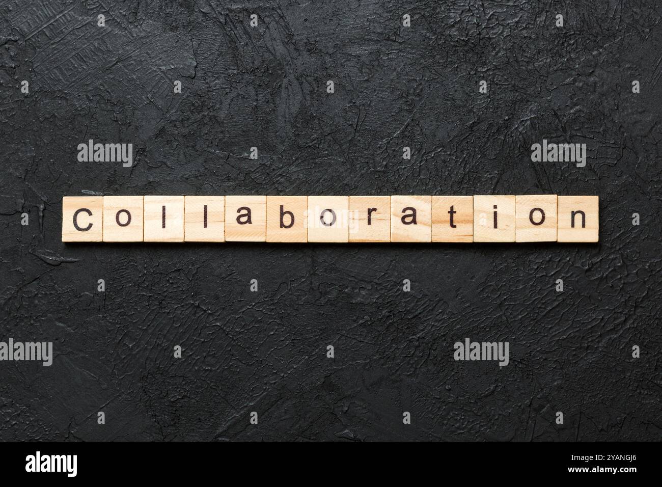 Collaboration word written on wood block. Collaboration text on cement ...