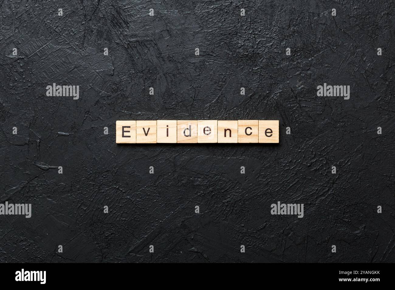 evidence word written on wood block. evidence text on table, concept ...