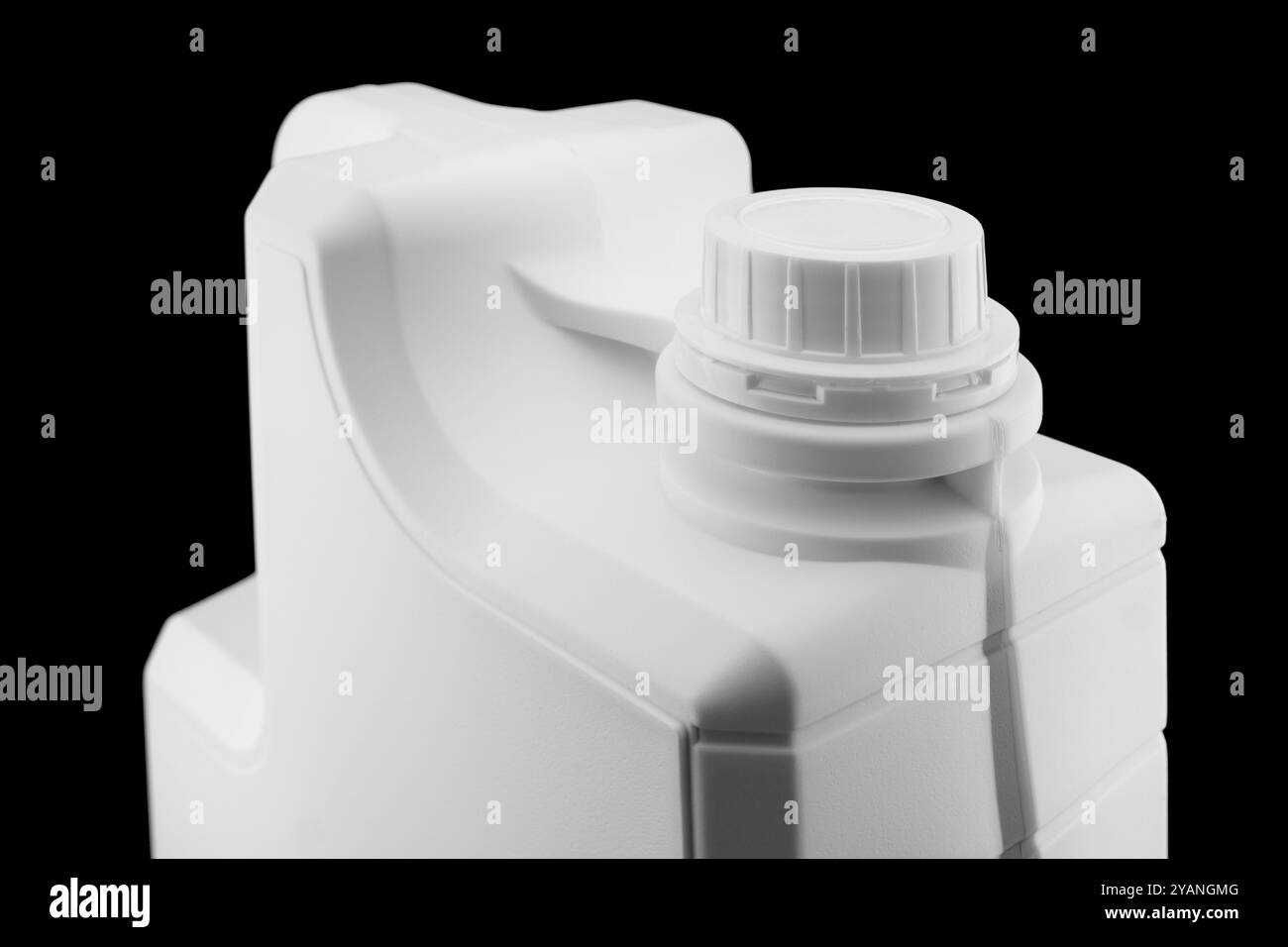 New white plastic oil canister isolated on black background. Storage ...