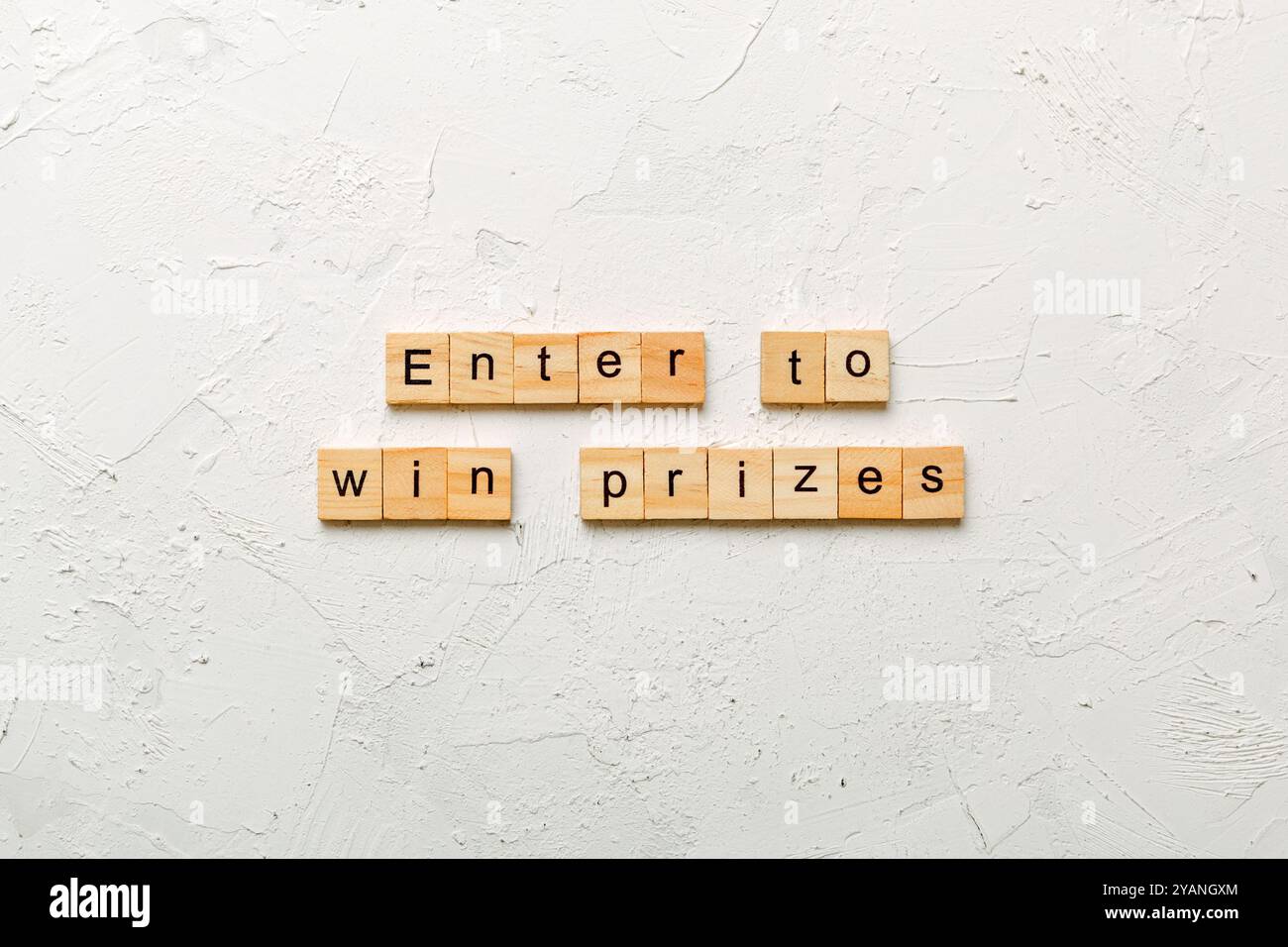 Enter to win prizes word written on wood block. Enter to win prizes ...