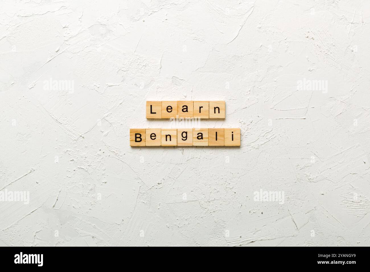 learn Bengali word written on wood block. learn Bengali text on table ...