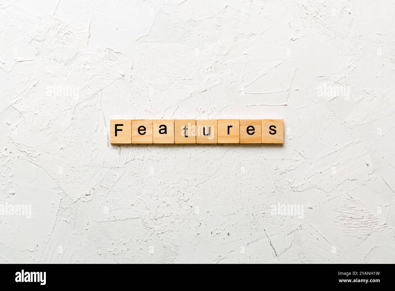 features word written on wood block. features text on table, concept ...