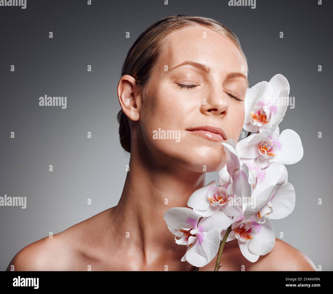 Mature woman, flowers and anti aging for natural cosmetics, glow or ...