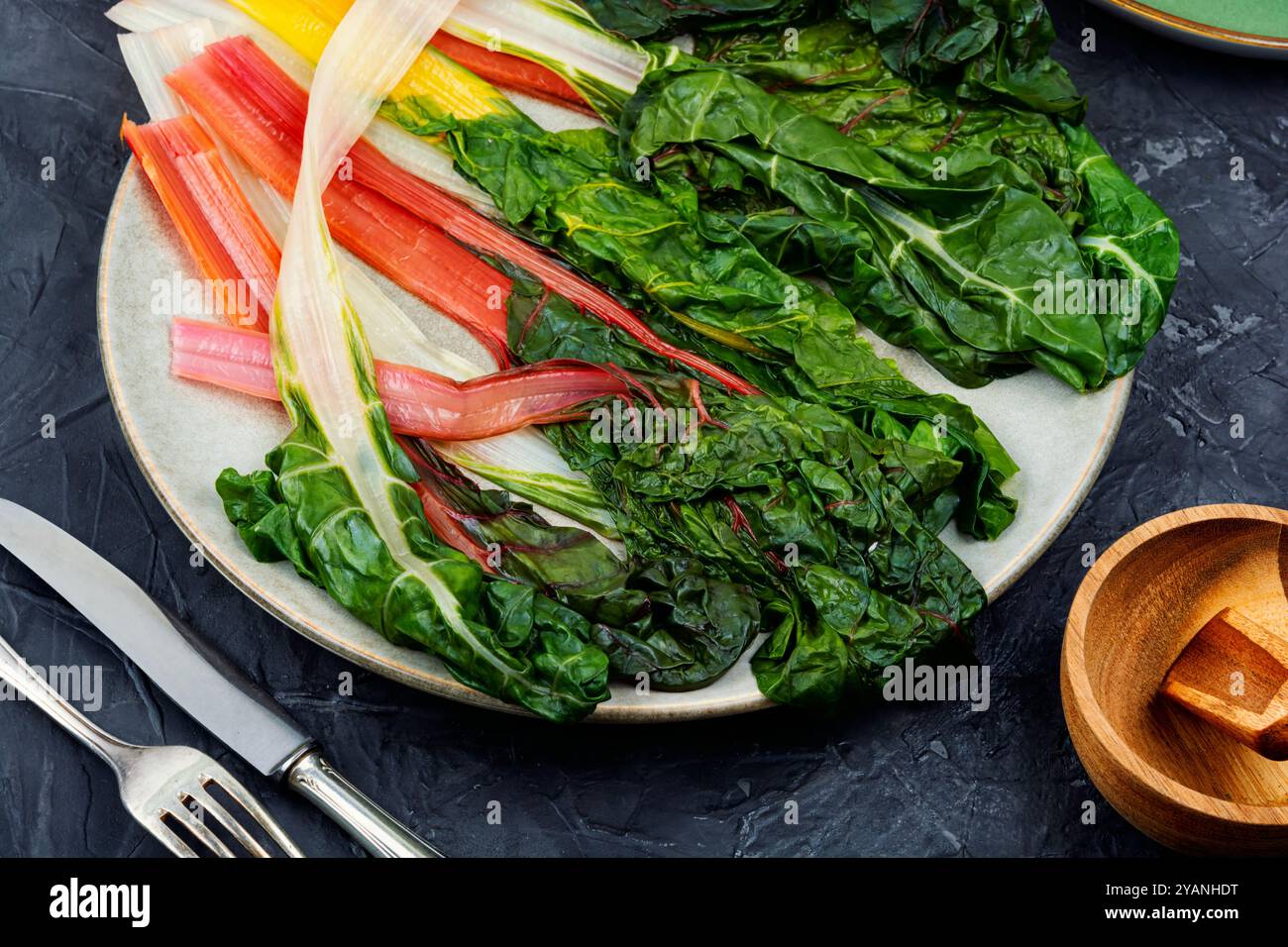 Tasty stir-fried colorful chard leaves on a plate. Sauteed swiss chard ...