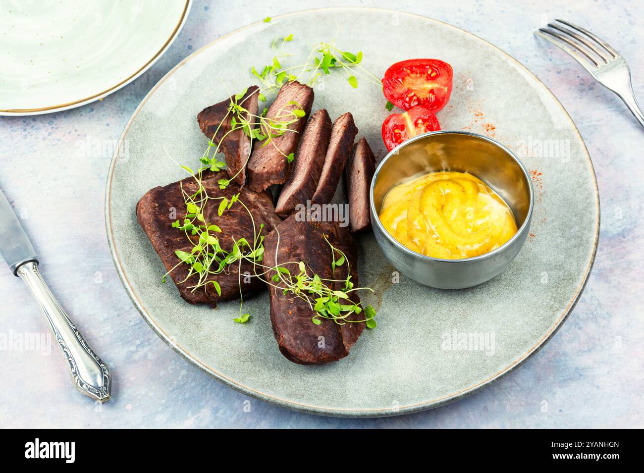 Roasted ostrich meat steaks with sauce. African cuisine Stock Photo - Alamy