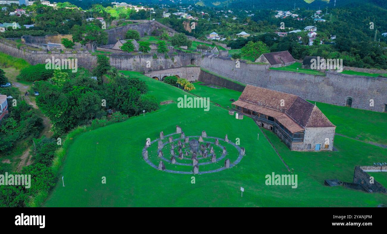 Round Monument with the big head in the middle and the stones around in ...