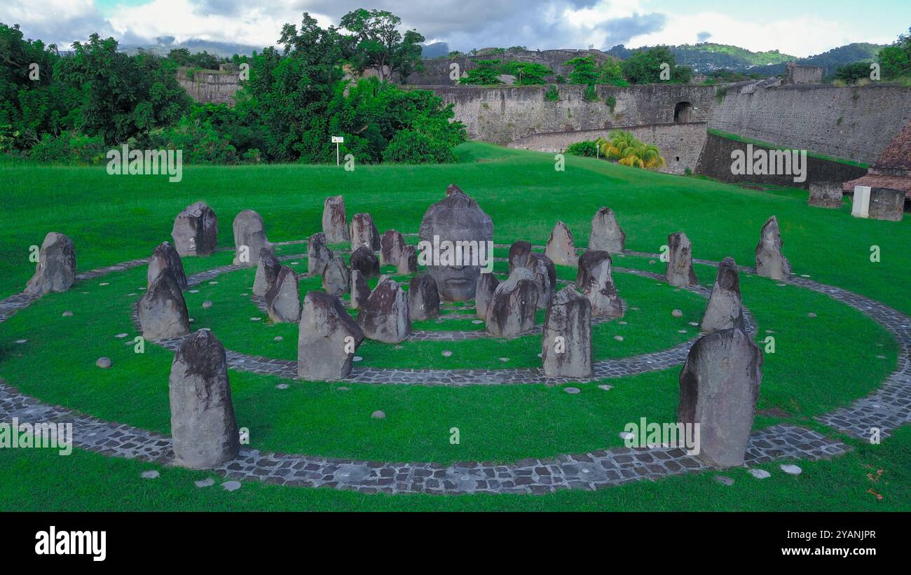 Round Monument with the big head in the middle and the stones around in ...