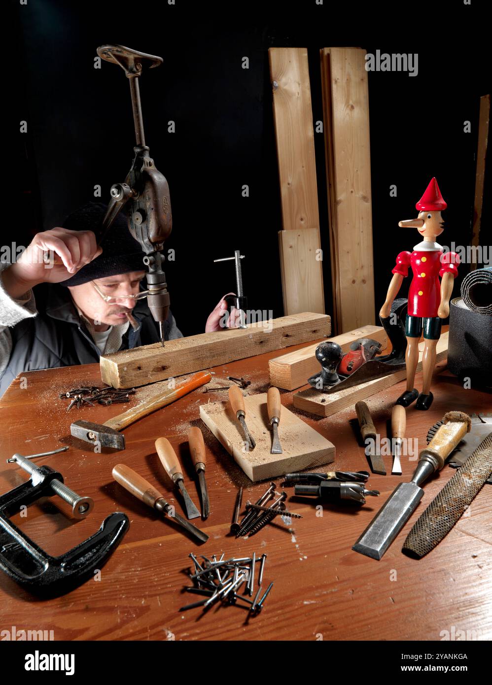 Still life with a carpenter's tools, on a table full of wood shavings ...