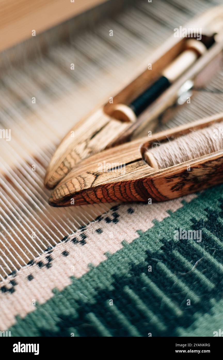Weaving shuttle on the warp Stock Photo - Alamy