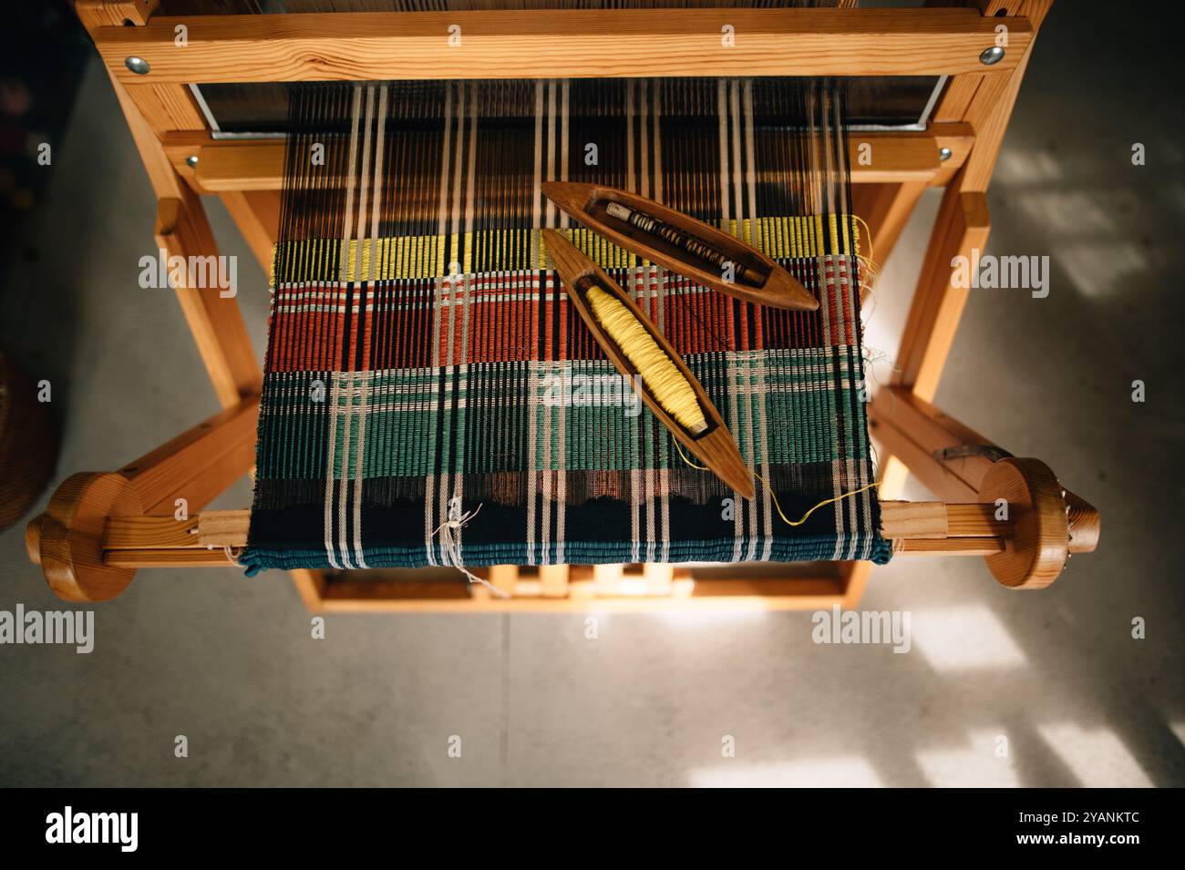 Weaving shuttle on the warp Stock Photo - Alamy