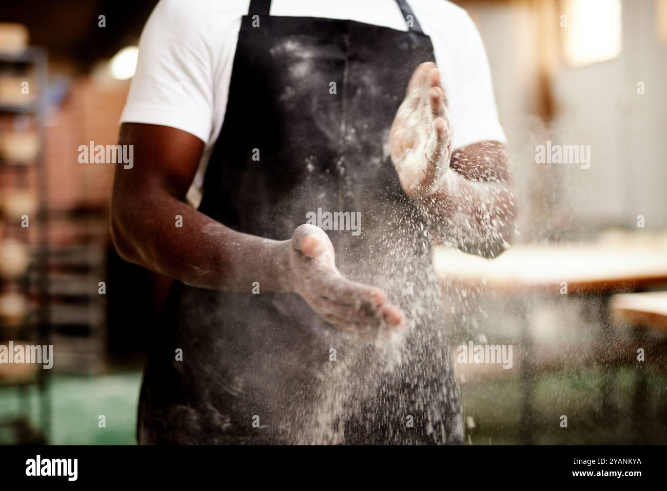 Black man, hands and dust with flour at bakery for bread, rolls or ...