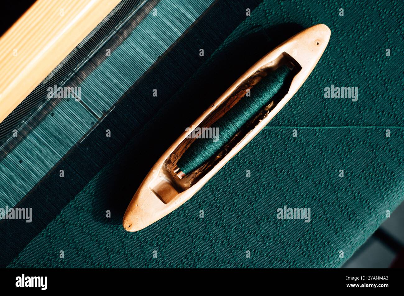 Weaving shuttle on the warp Stock Photo - Alamy