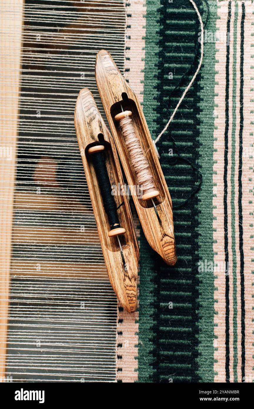 Weaving shuttle on the warp Stock Photo - Alamy