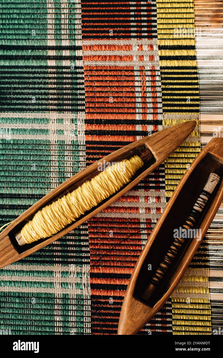 Weaving shuttle on the warp Stock Photo - Alamy