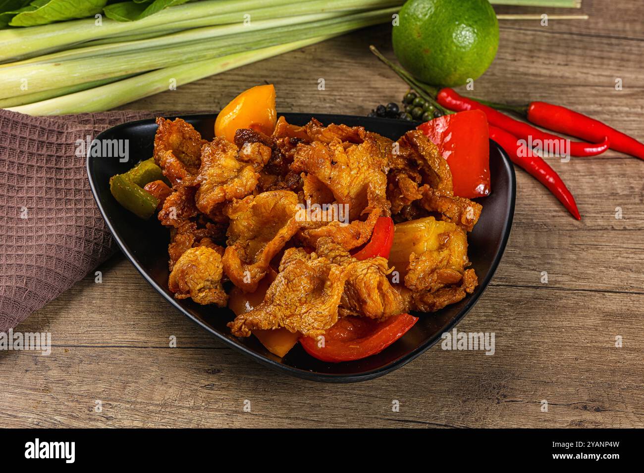 Asian cuisine - roasted crocodile meat with vegetables Stock Photo - Alamy